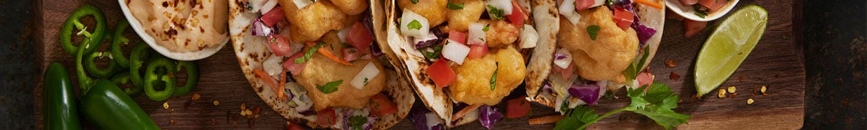 La comida capeada: diferencias entre capear, empanar y rebozar